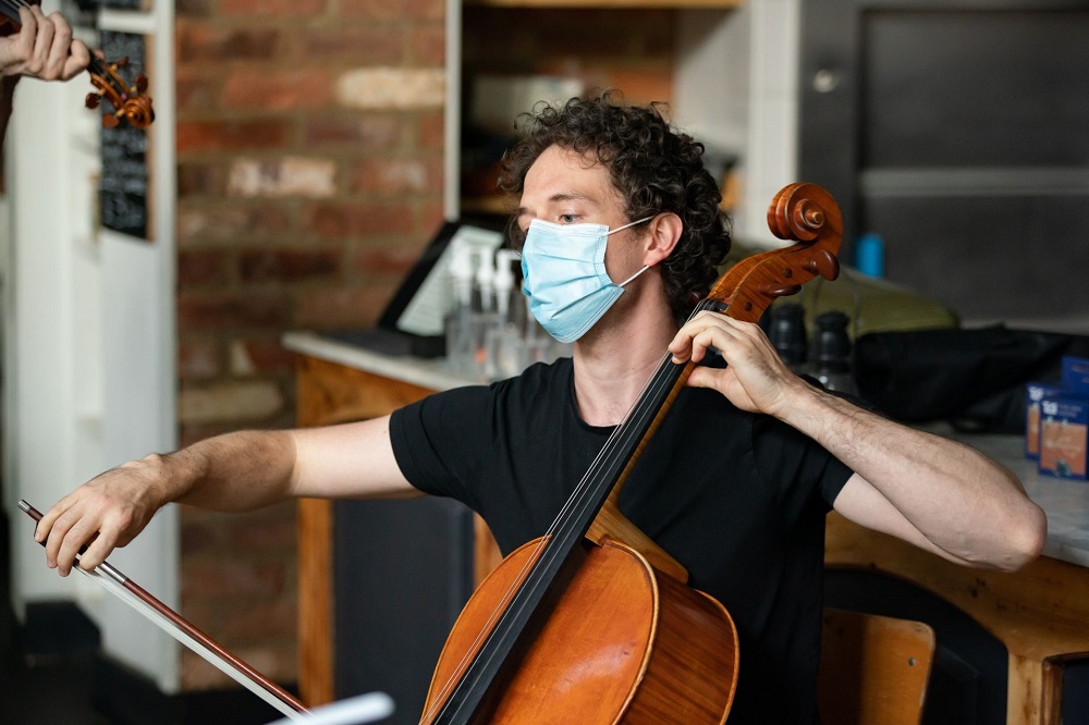 A masked elegy: portraits of string players at the Fidelio Orchestra Café